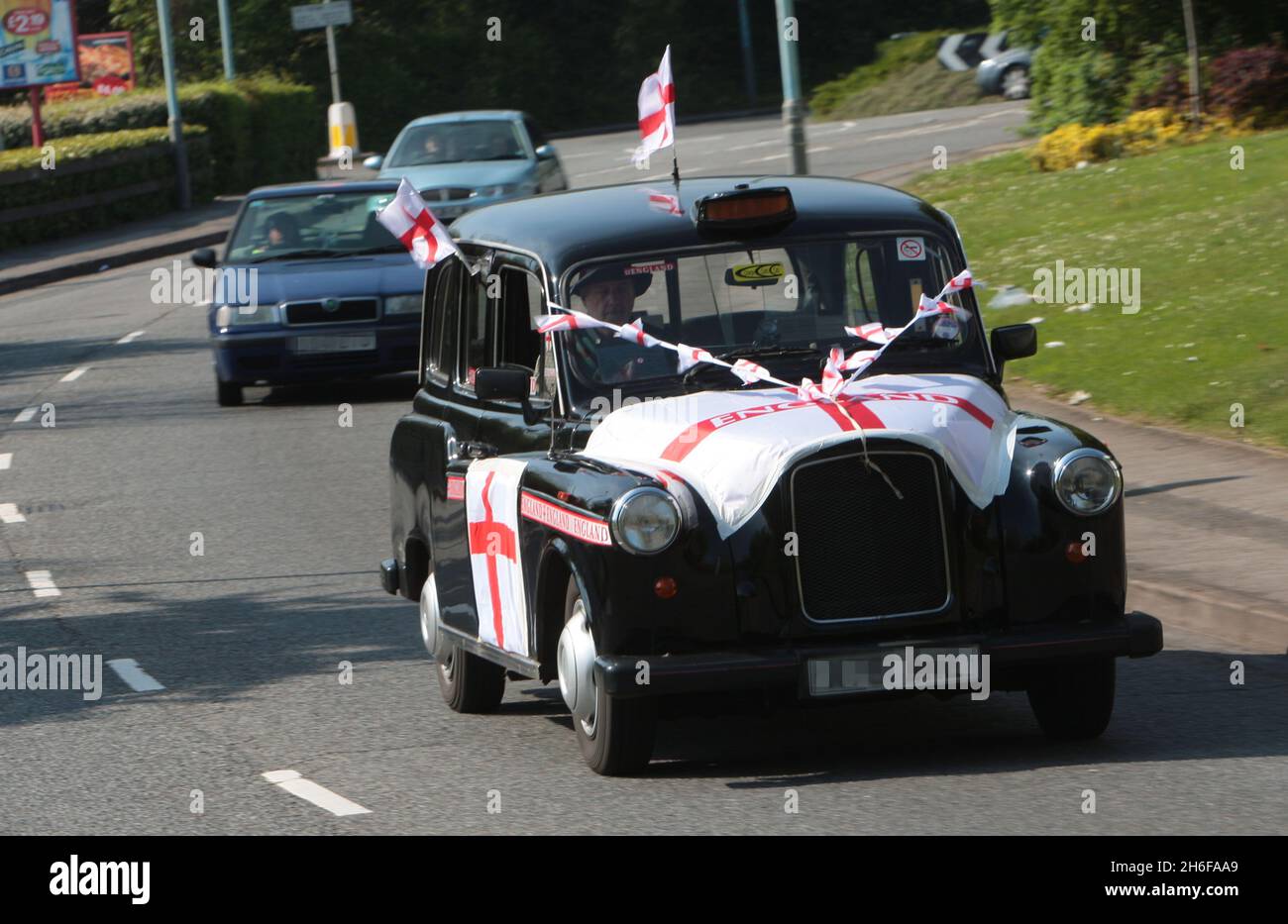 St George's Day - A London taxi driver covers his cab in England ...