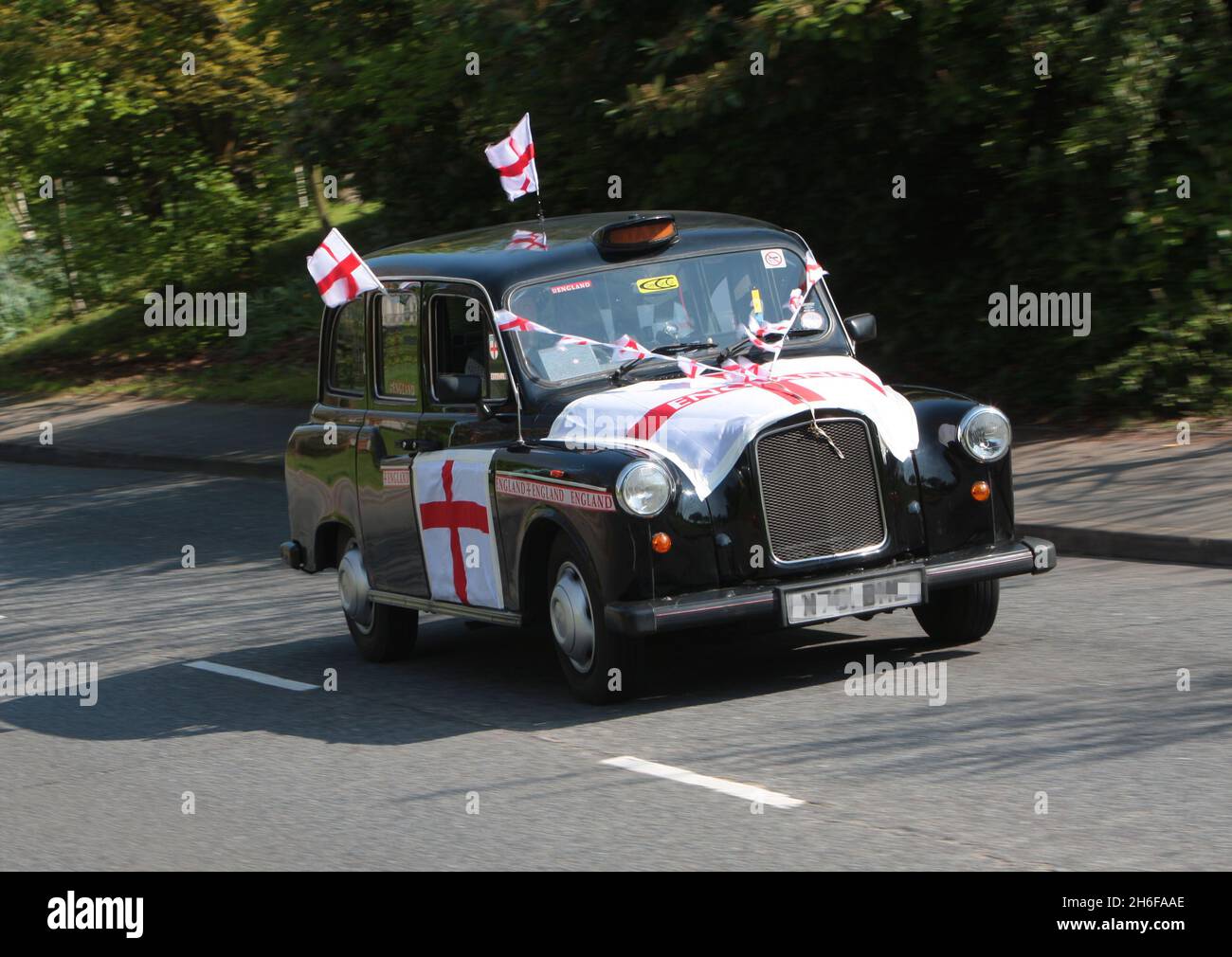 St George's Day - A London taxi driver covers his cab in England ...