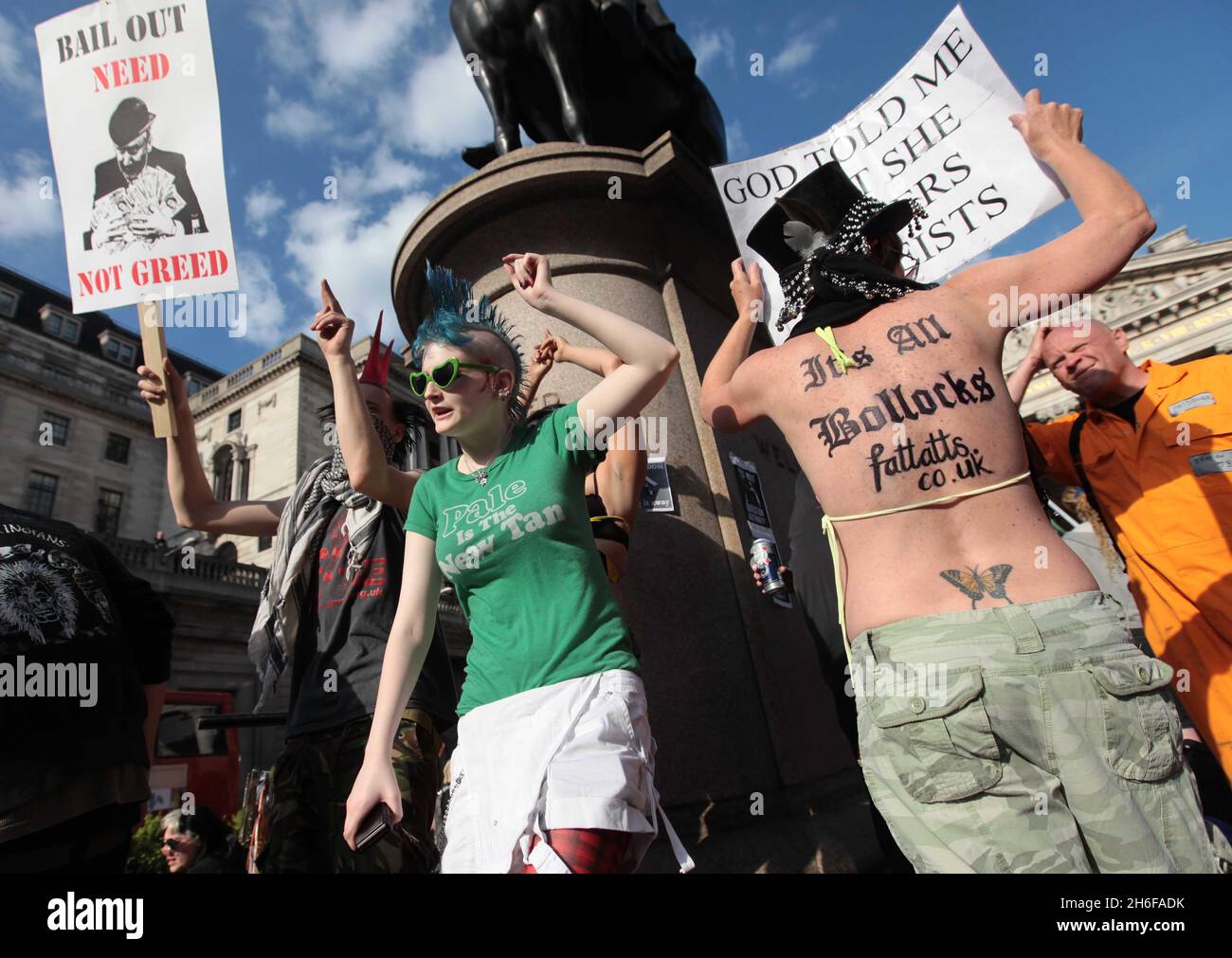 Protestors dressed as pigs and police officers during the traditional ...