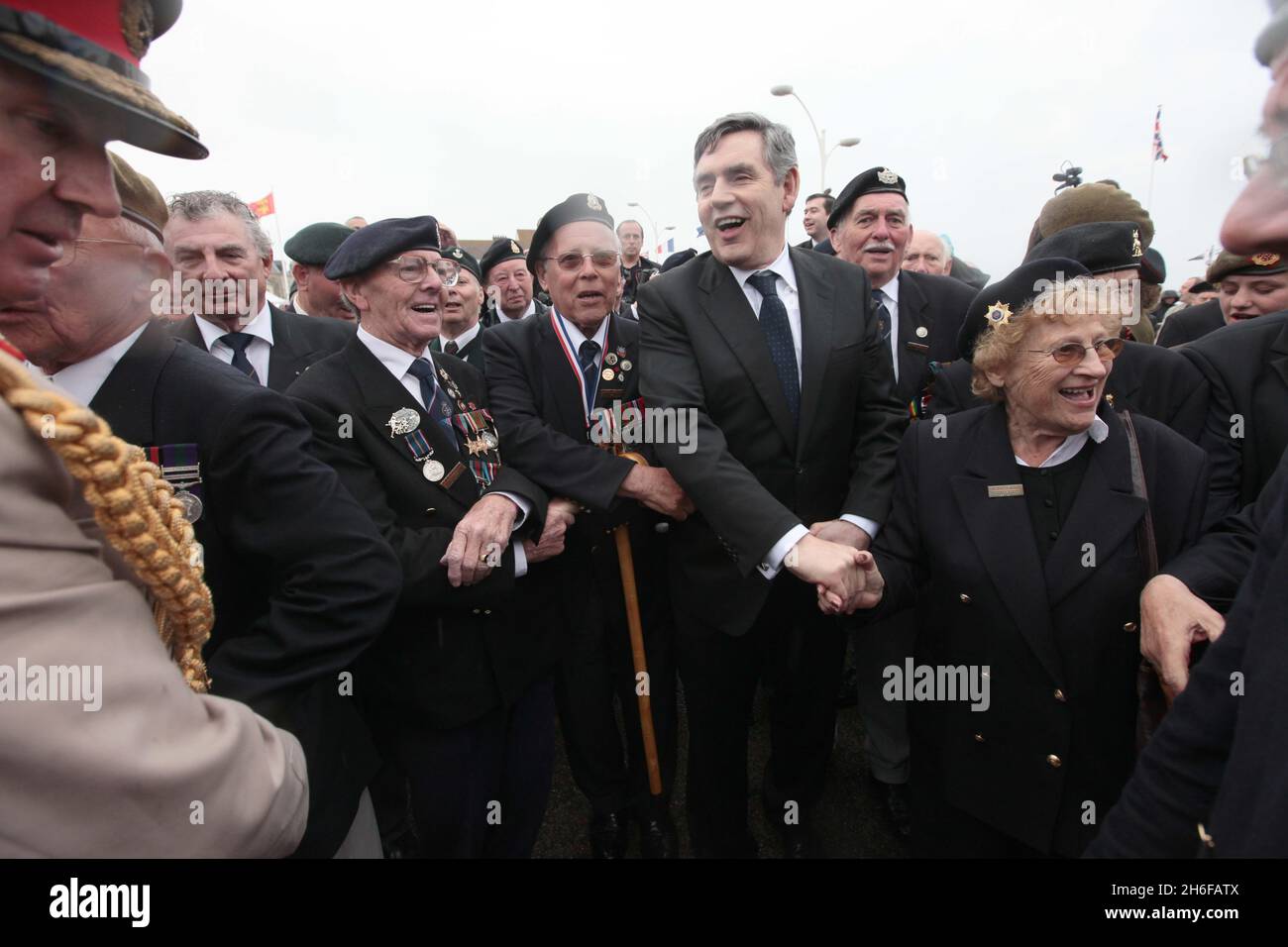 British Prime Minister Gordon Brown sings the Auld Lang Syne with ...