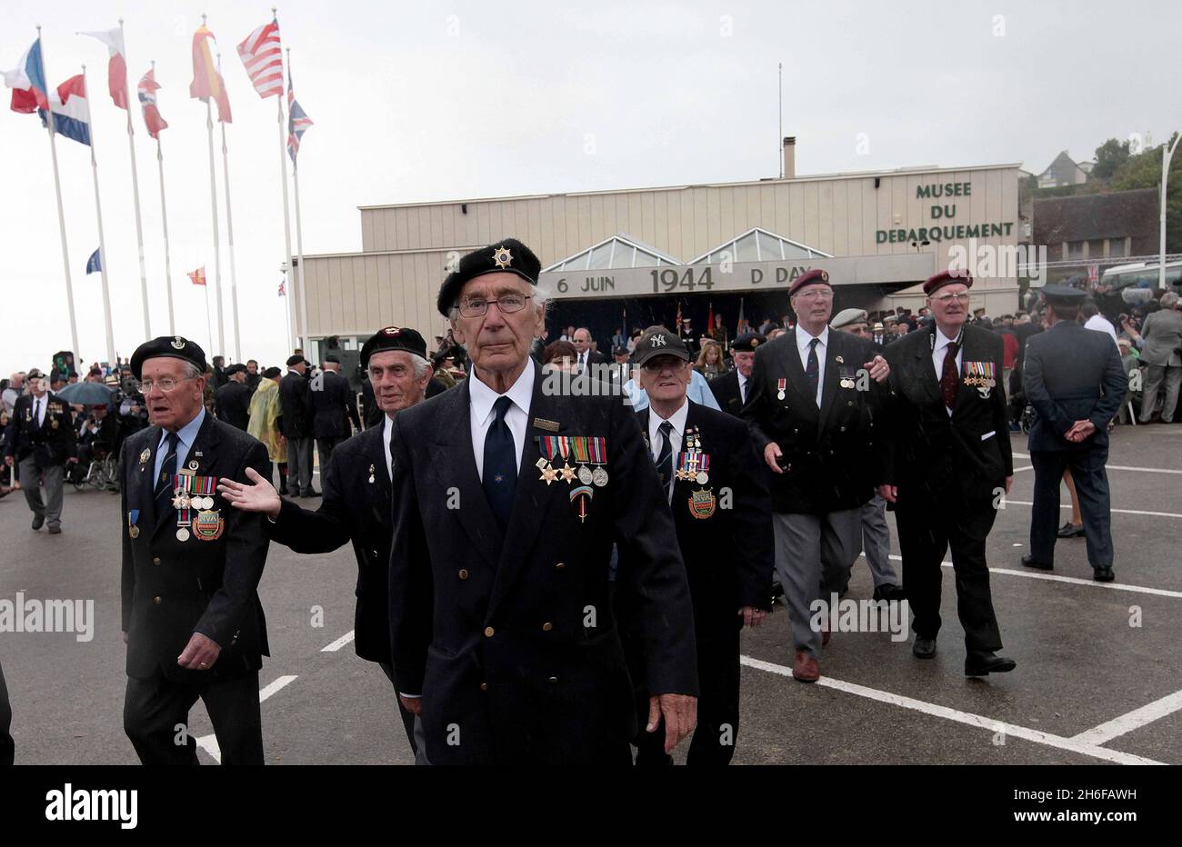 Normandy war veterans finished their march past Arromanche in France ...