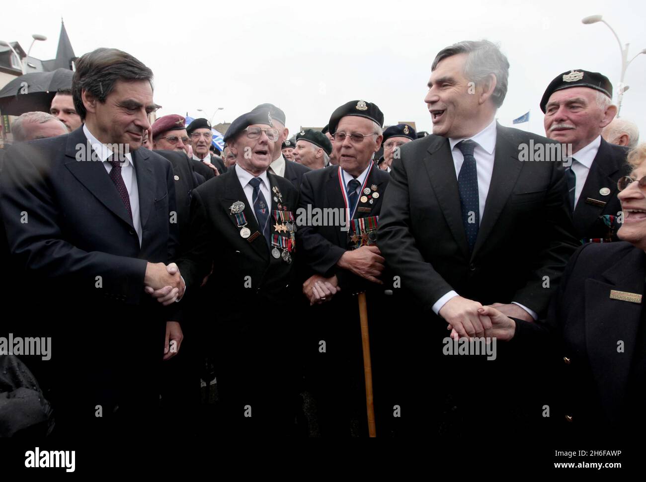 British Prime Minister Gordon Brown sings the Auld Lang Syne with ...