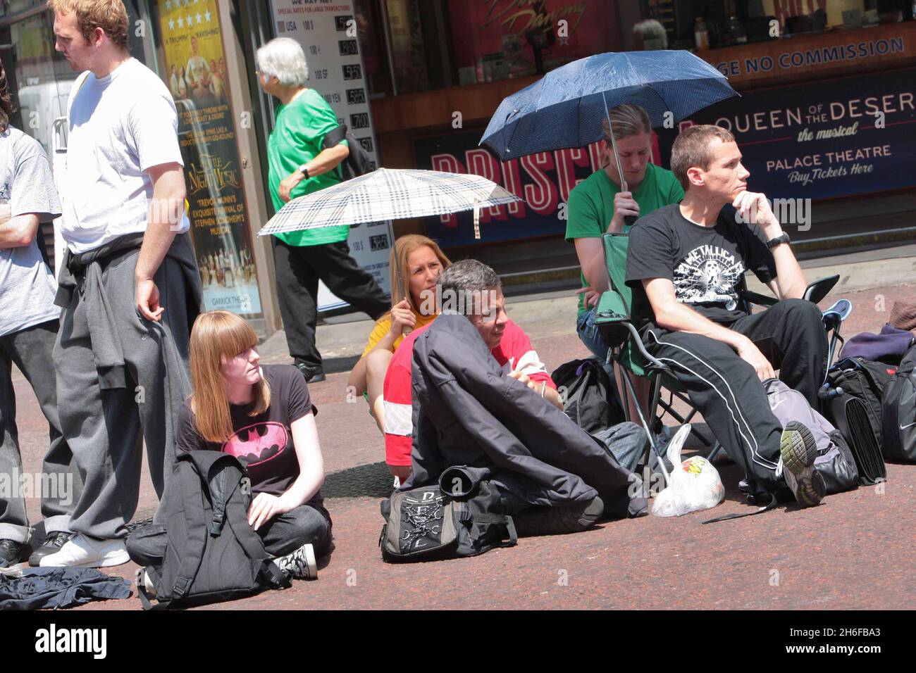 Johnny Depp fans queue in the heat outside the Empire cinema in London ...