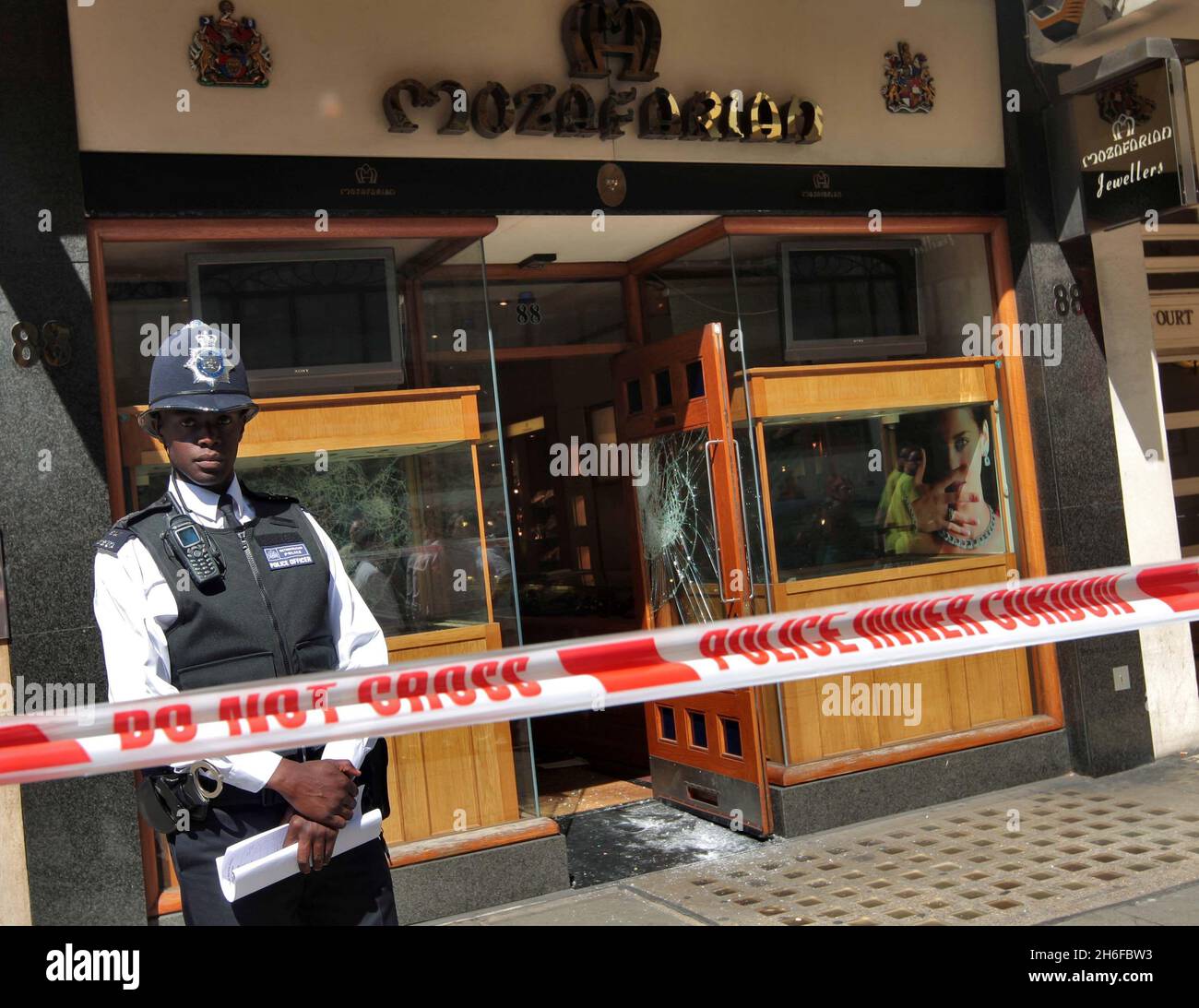 Police at the scene of a smash and grab robbery at a jewellers opposite ...