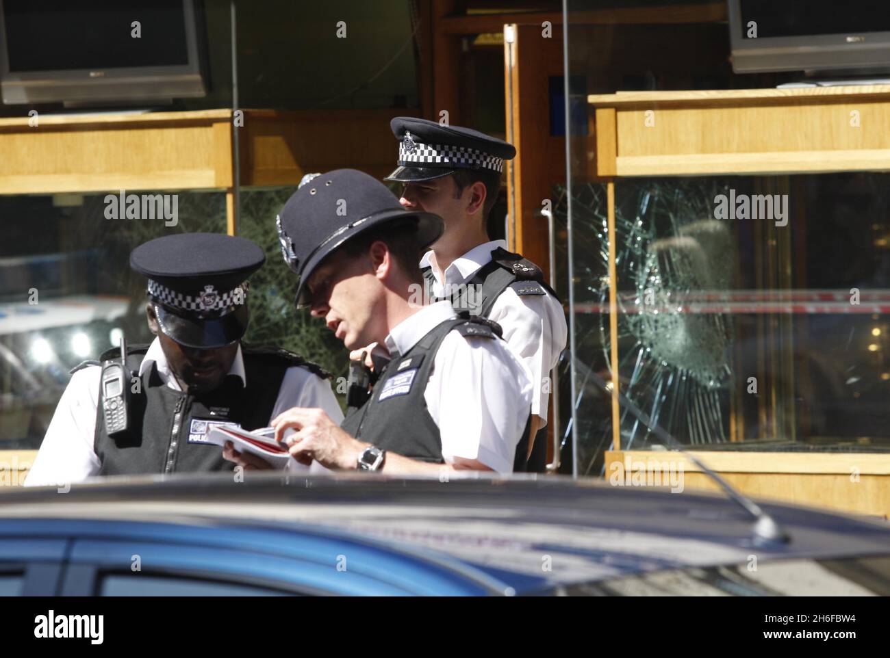 Police at the scene of a smash and grab robbery at a jewellers opposite ...