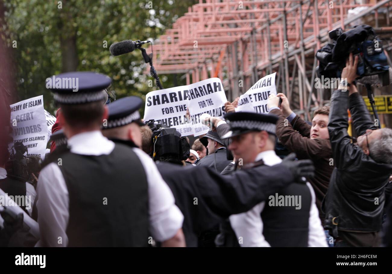 Protestors pictured in Westminster this afternoon as the controversial ...