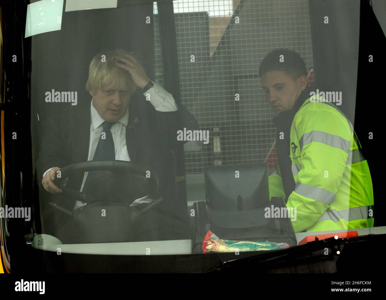 London Mayor Boris Johnson gets behind the wheels of an electric van in ...