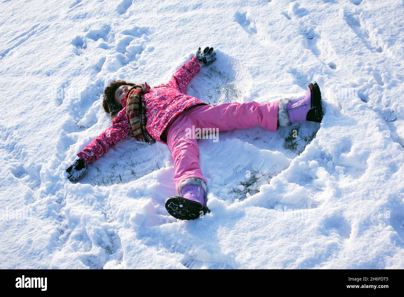 Jessie, aged 10, enjoys the day off school in the snow on Wanstead ...