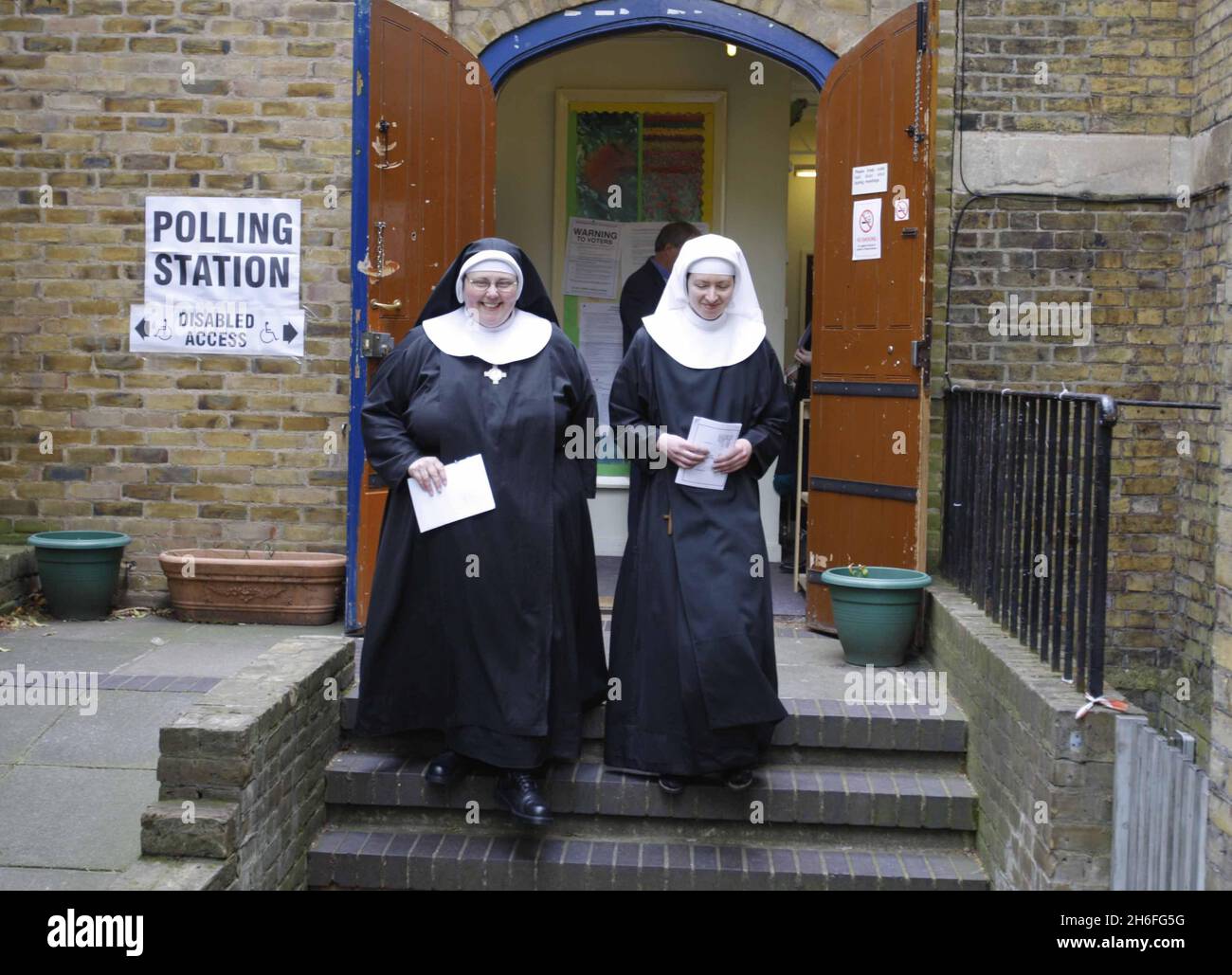 Nuns at a polling station at St John's Parish church in central London ...