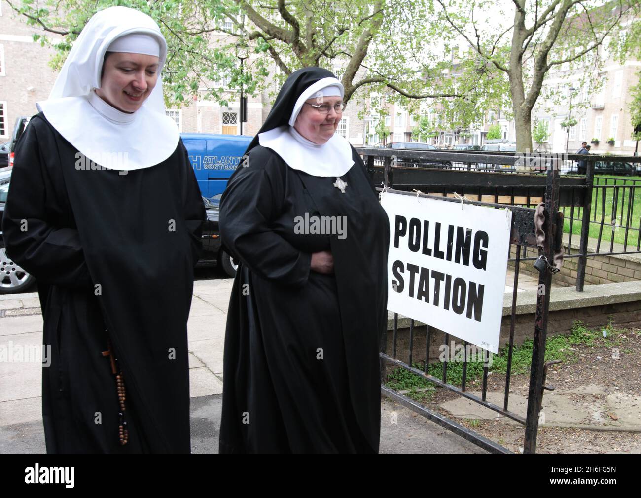 Nuns arrive at a polling station at St John's Parish church in central ...