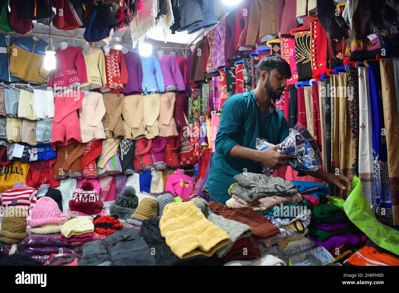 Shopkeepers are arranging warm woolen clothes at their shops as the ...