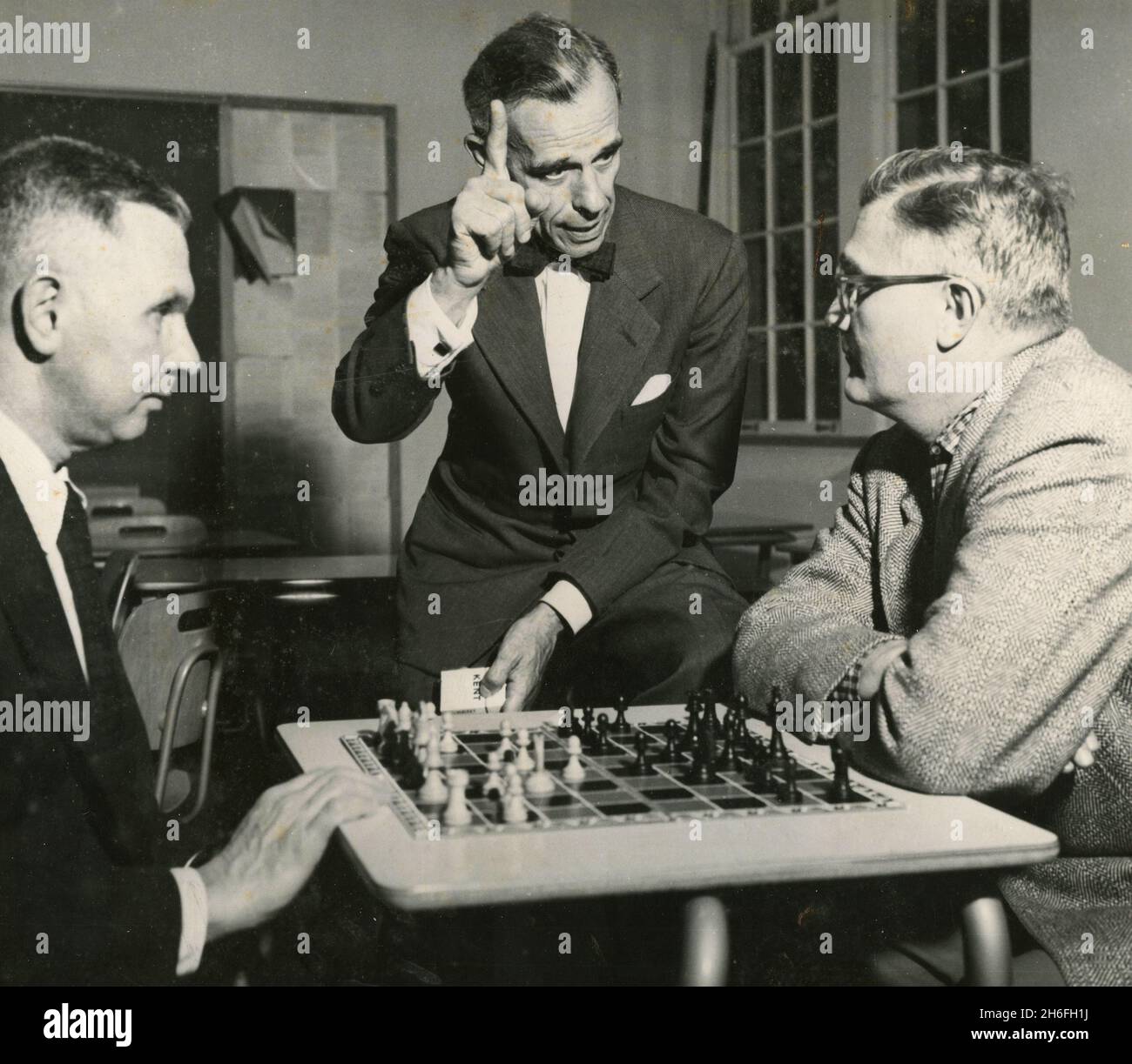 Chess expert explains the game to two students at Scarsdale Adult ...