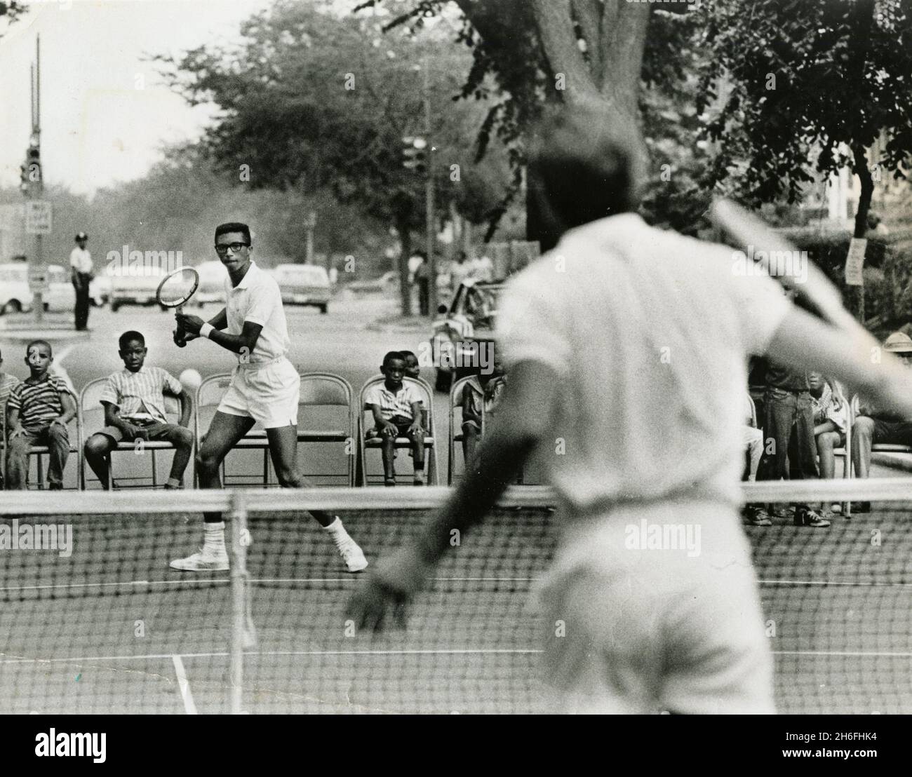 American tennis player Arthur Ashe playing with Charles Pasarell in a ...