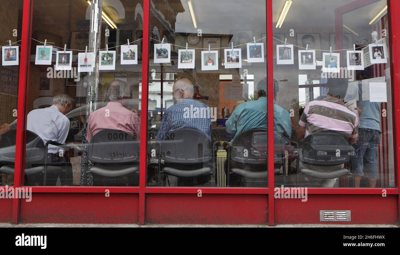 Photographs by local artist Alison Bray are hung in the window of Mario ...
