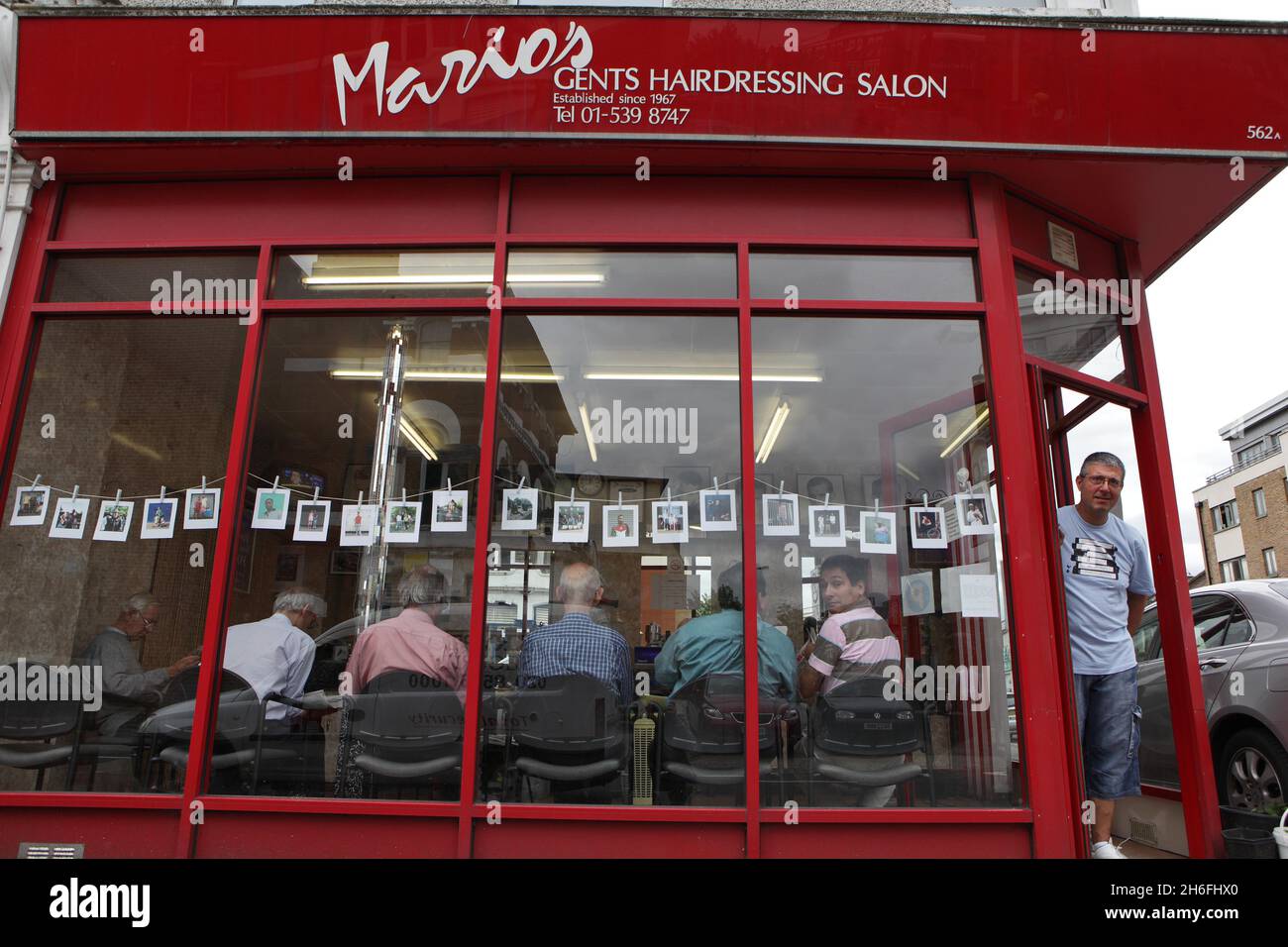 Photographs by local artist Alison Bray are hung in the window of Mario ...