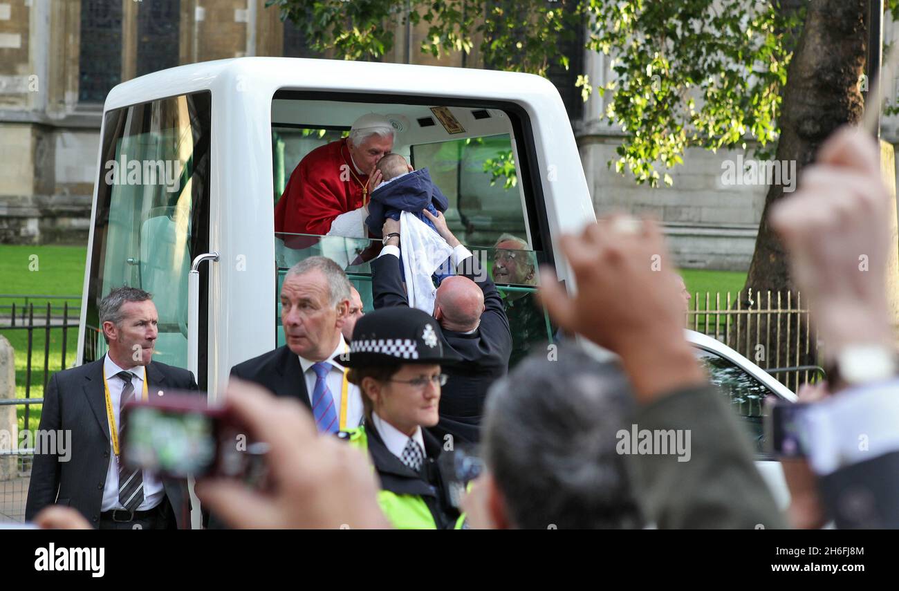Pope Benedict XVI pictured blessing a young boy in Westminster this ...