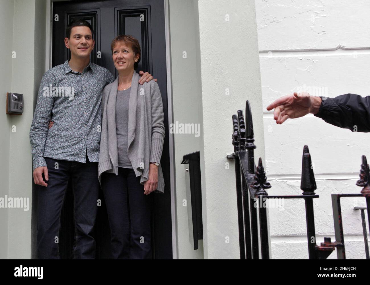David Miliband poses with his wife Louise Shackleton outside their ...