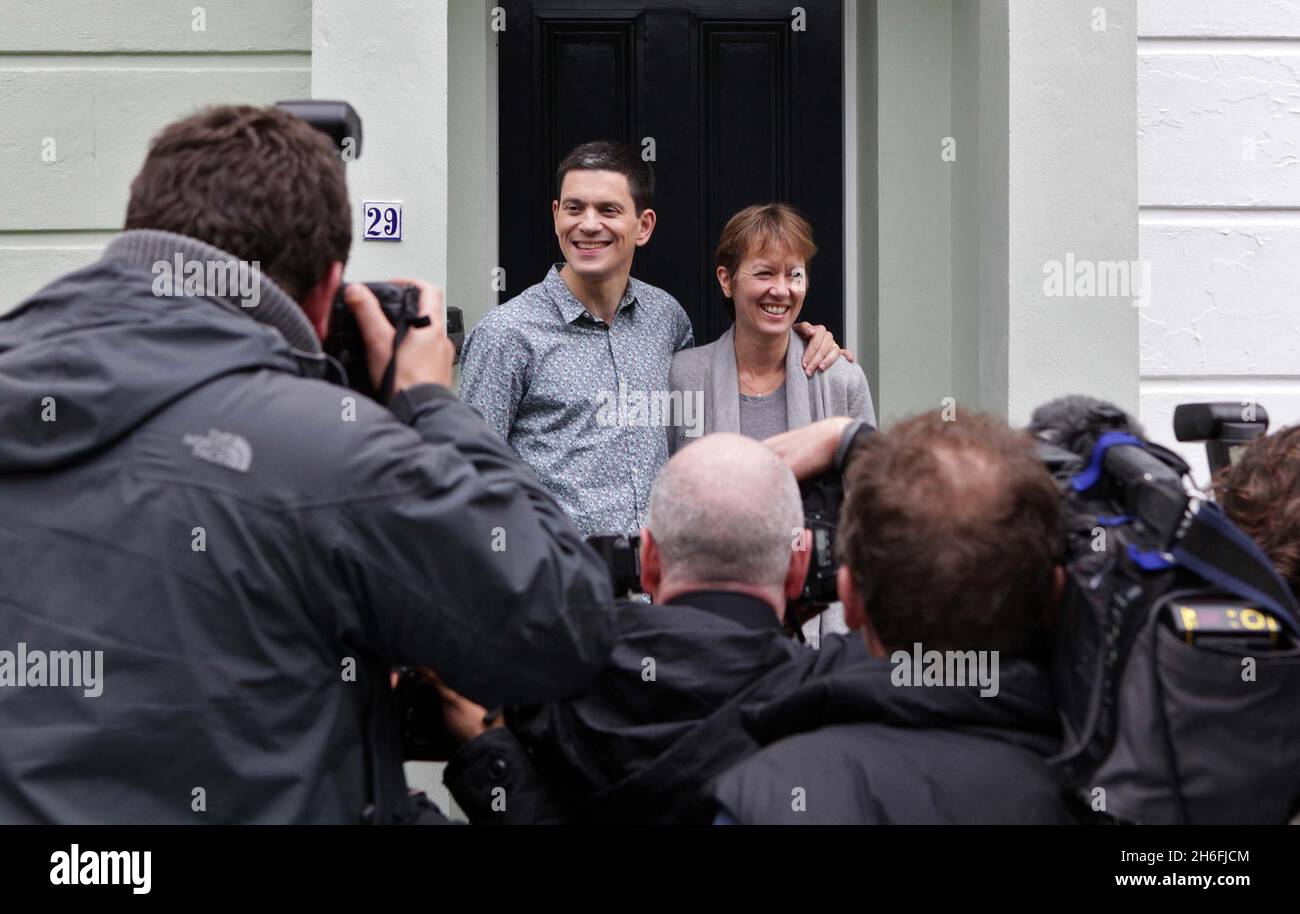 David Miliband poses with his wife Louise Shackleton outside their ...