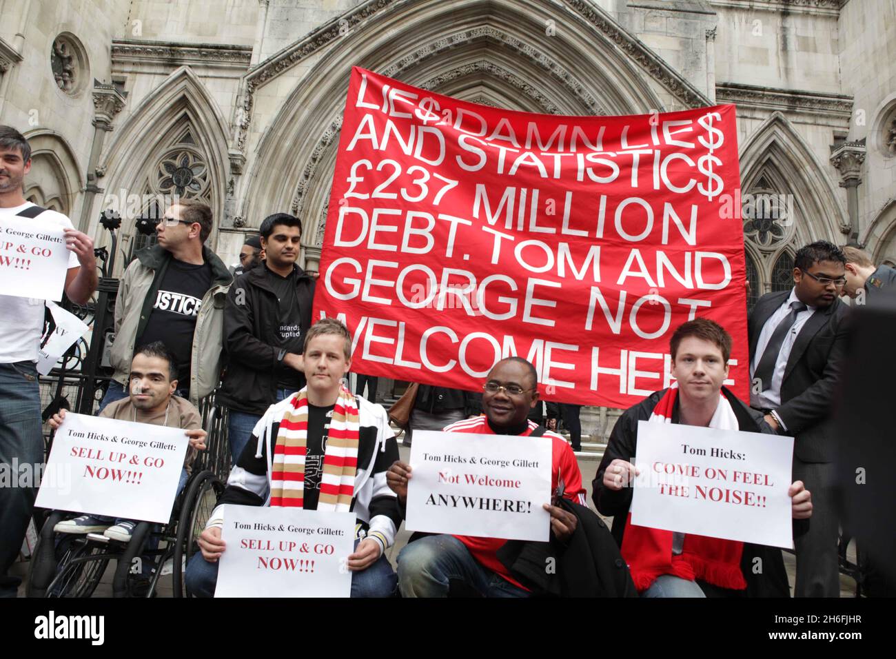 Liverpool football club fans pictured outside the High Court in London today as the club's major ...