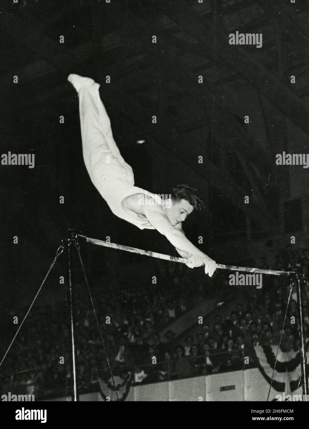 American artistic gymnast Edward Scrobe performing in the horizontal ...