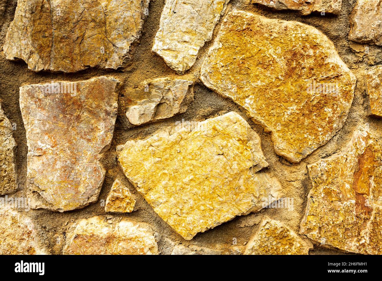 Background of dark yellow oxide rough stone wall texture horizontal photo Stock Photo - Alamy