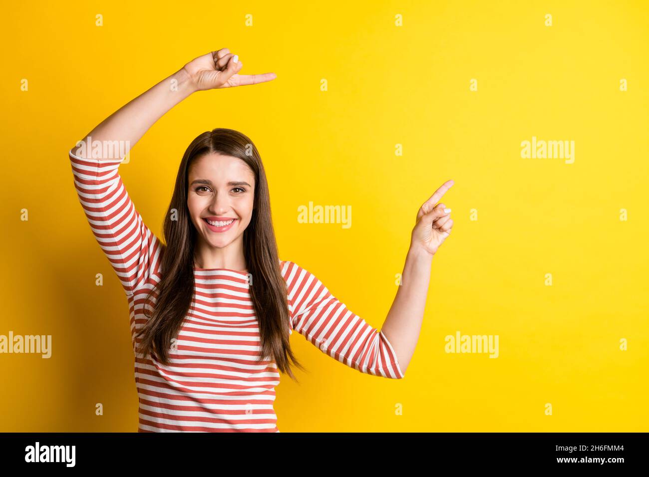 Portrait of attractive cheerful girl showing copy space look idea ...
