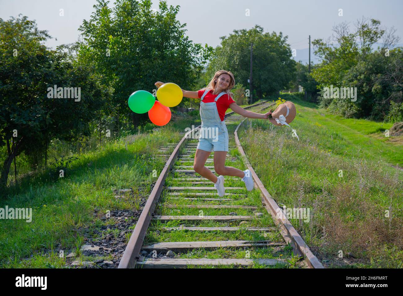 Cheerful girl jumping hi-res stock photography and images - Alamy