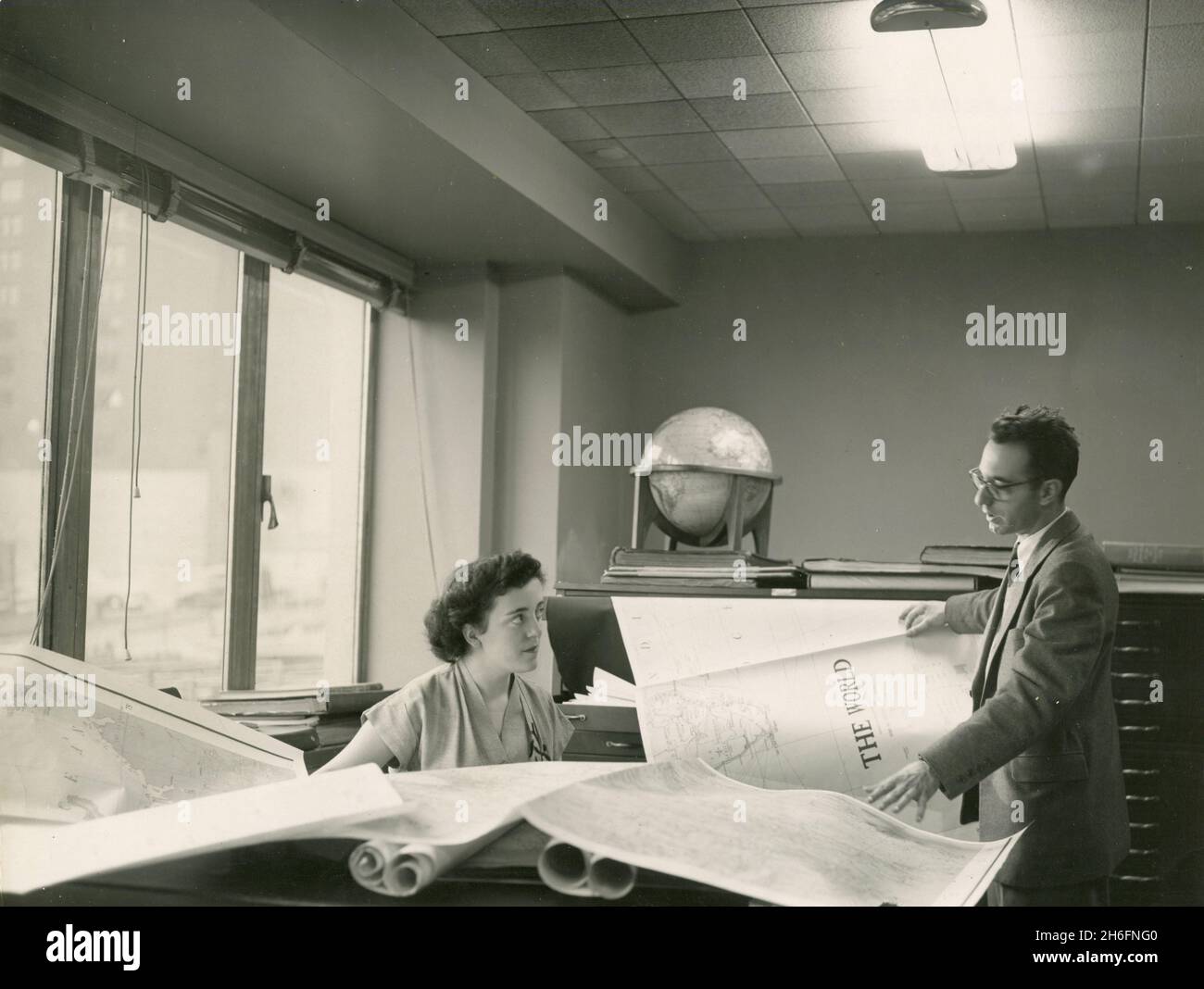 Working in the map room of the Library at the United Nations ...