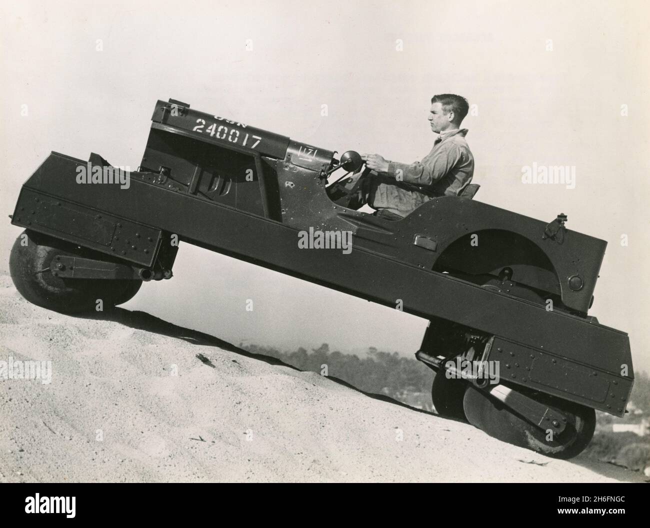 Experimental Rolligon vehicle traveling up-grade in deep sand, USA 1953 ...