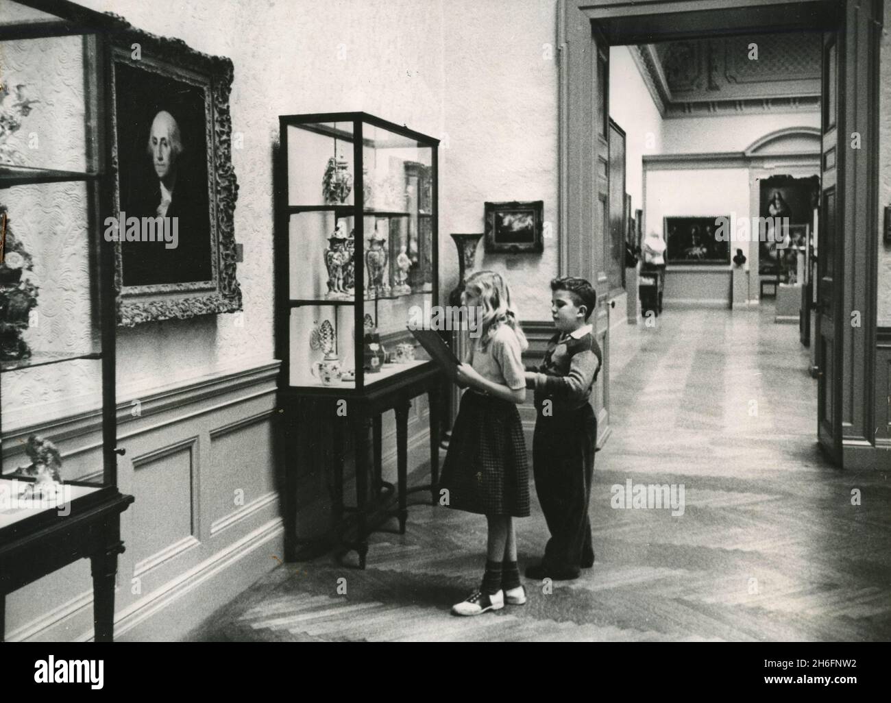Two Baltimore school children admire the portrait of George Washington ...