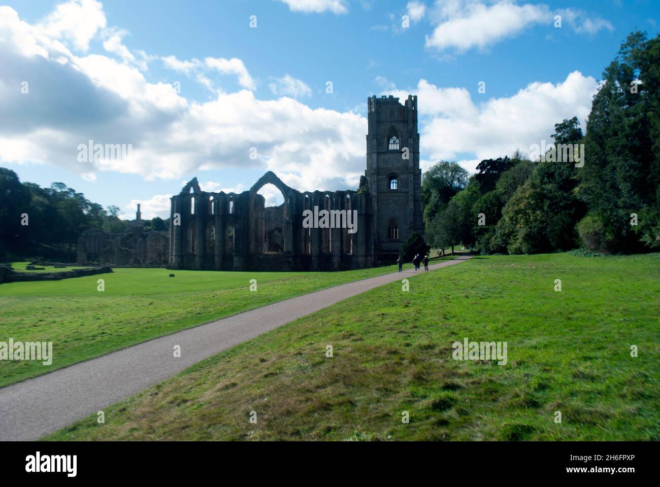Visitors walking on path near twoer and Chapel of the Altars, Fountains ...