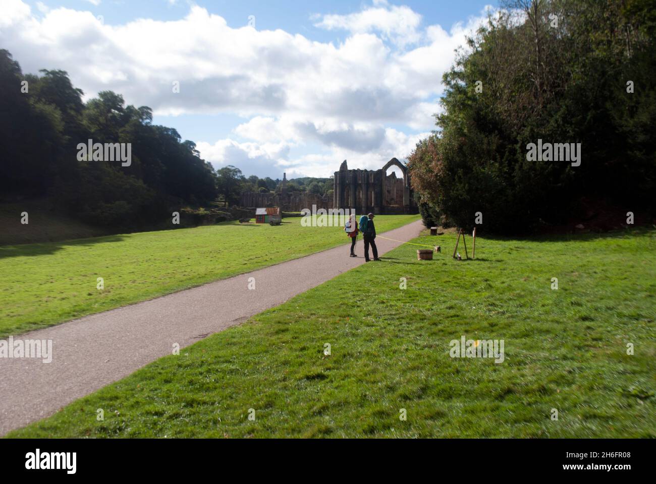 Visitors walking on path near twoer and Chapel of the Altars, Fountains ...