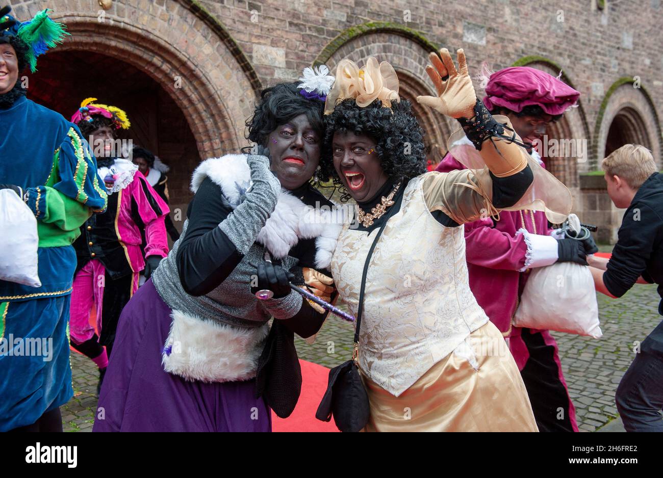 ENSCHEDE, THE NETHERLANDS - NOV 13, 2021: Two female 'black pete's ...