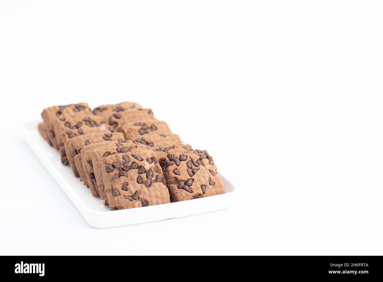 Square shaped Chocolate Chip Cookies Served In White Tray. Isolated On ...