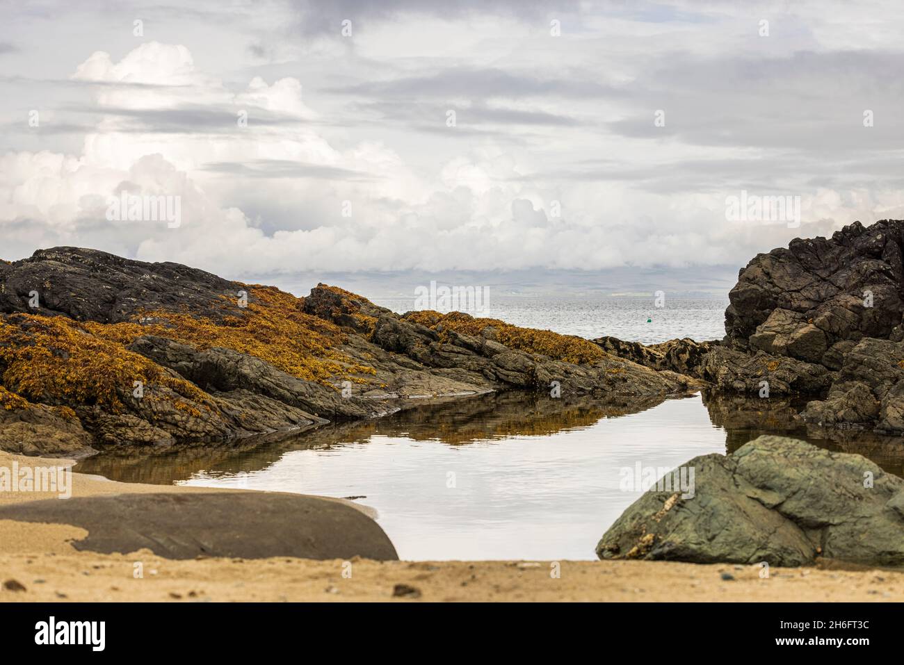 Rocks and rockpool on the beach at the Old Head Louisburgh, County Mayo ...