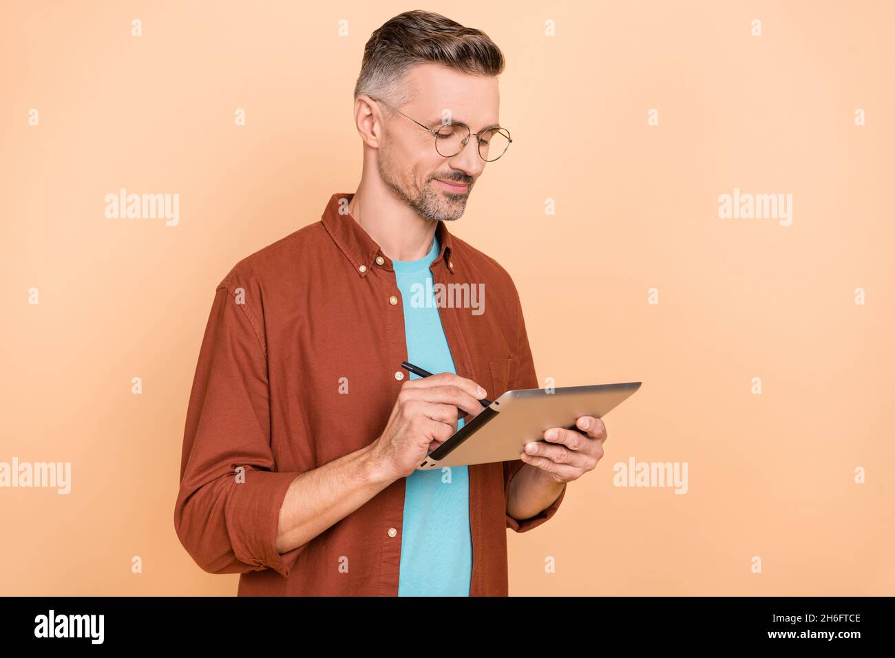 Profile side photo of focused ceo guy use gadget paint stylus screen ...