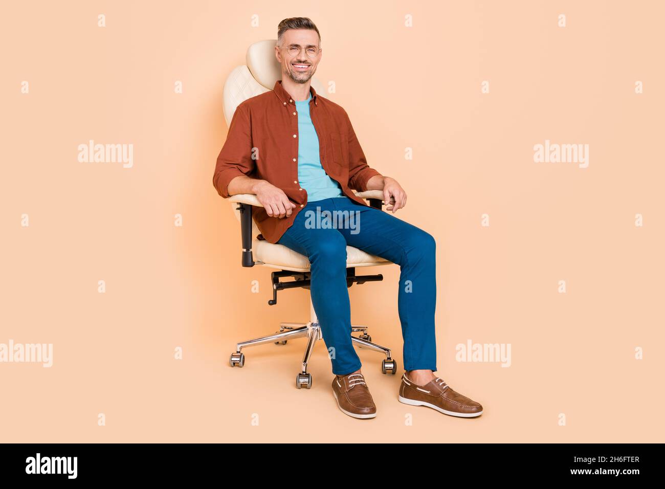 Full length photo of positive attorney guy sit leather office chair ...