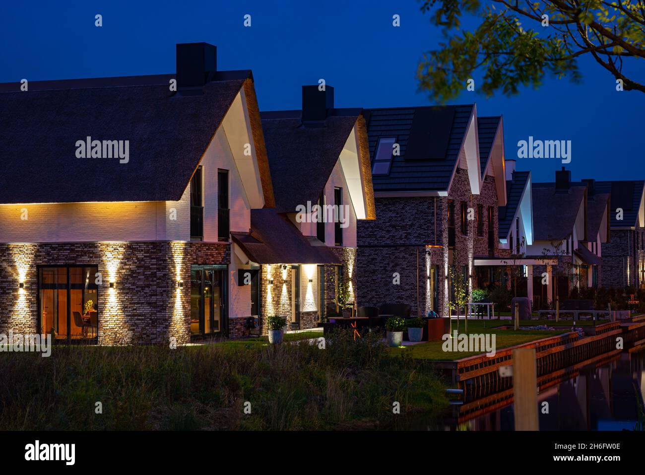 Scenic night view of buildings in a new residential area illuminated by ...