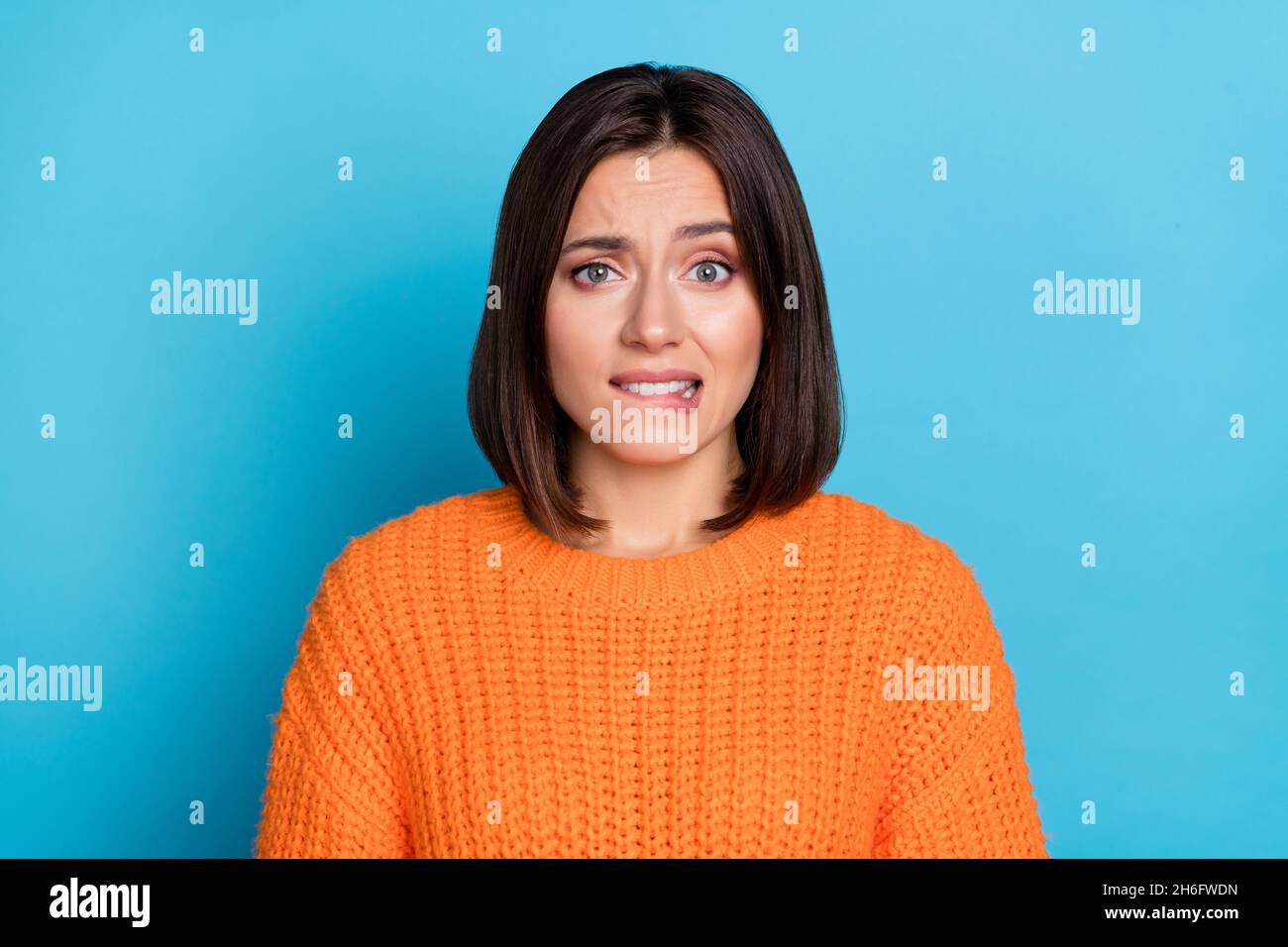 Portrait of attractive unsure uncertain girl biting lip waiting ...