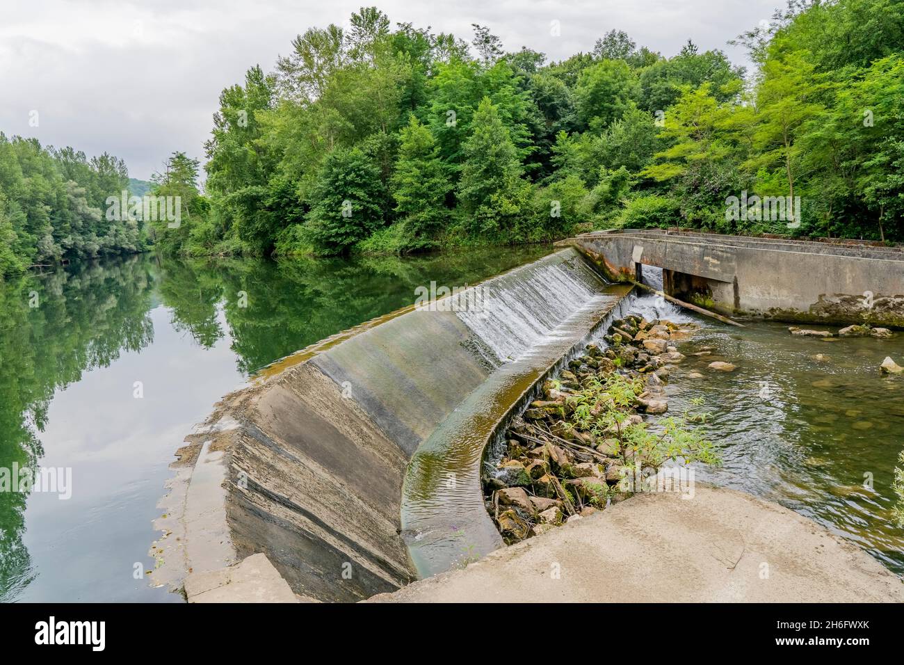 Small hydroelectric power plant in the river, France. Operating since ...