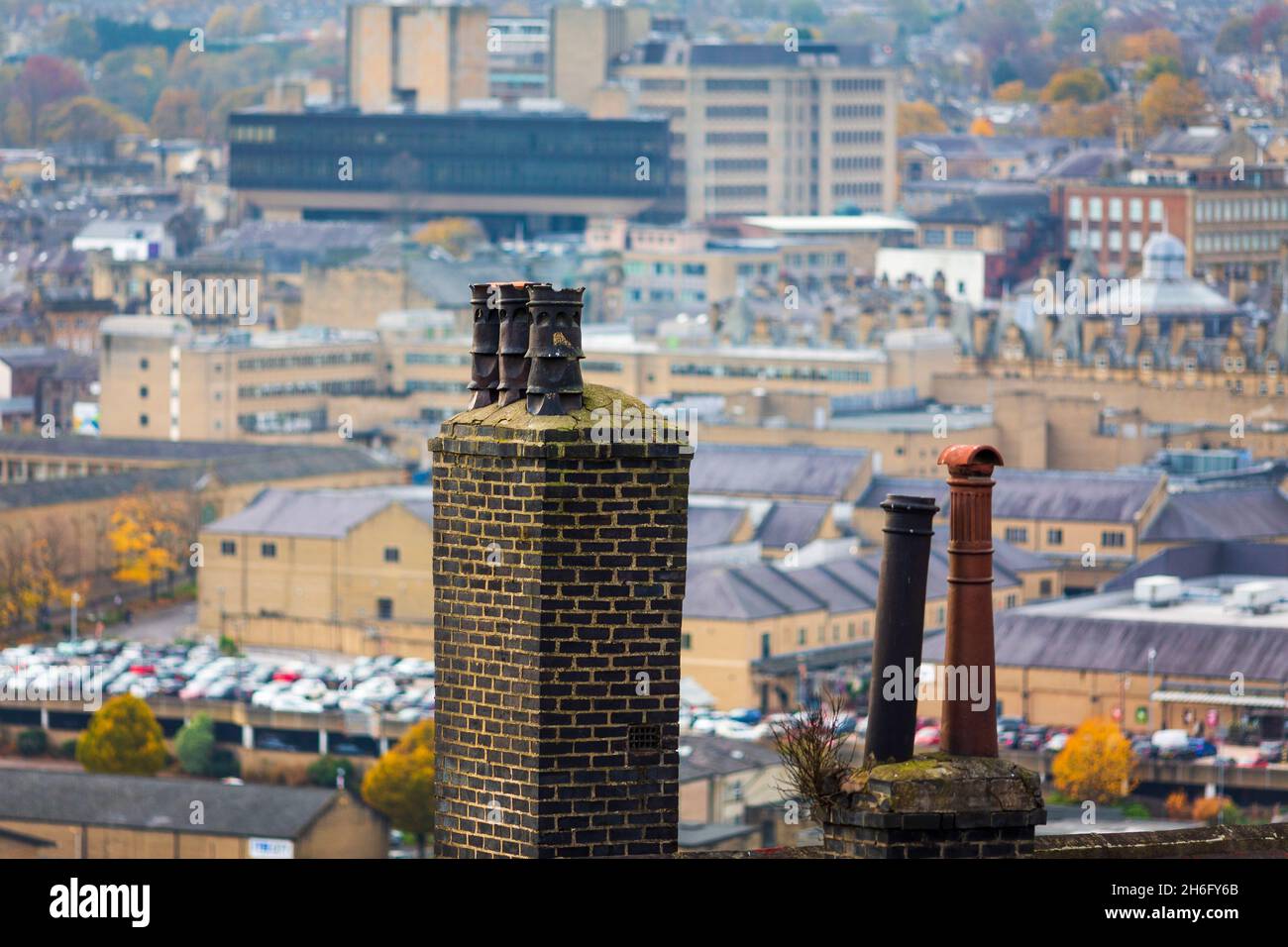Traditional old style chimney pots on top of stone chimneys in the ...