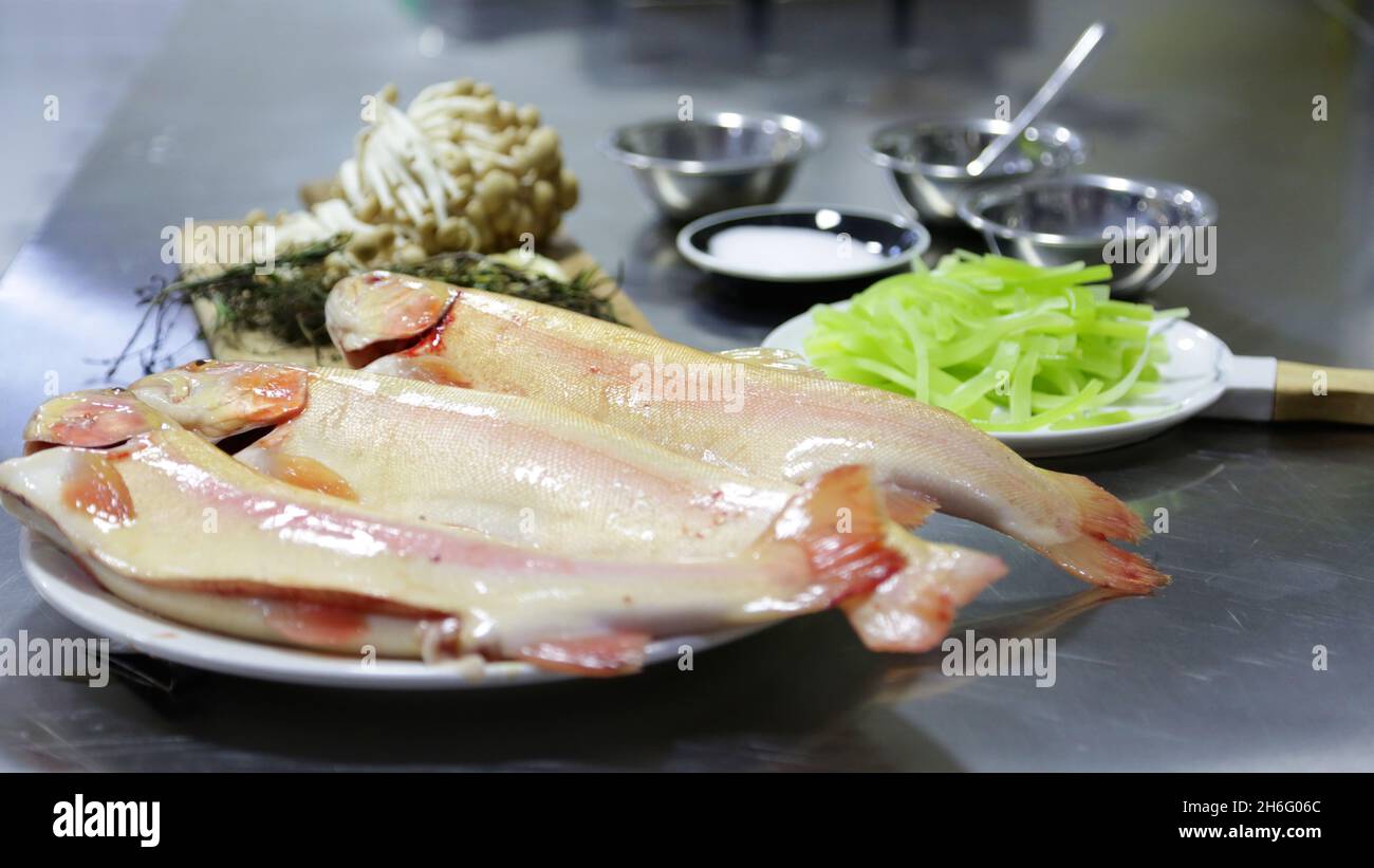 Fish preparation in the kitchen of the restaurant, fresh organic salmon ...