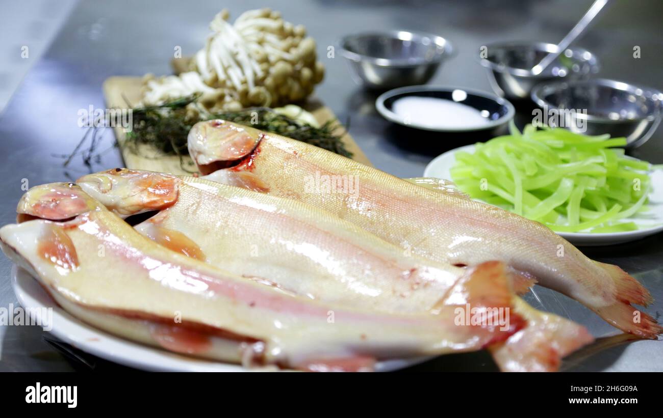 Fish preparation in the kitchen of the restaurant, fresh organic salmon ...
