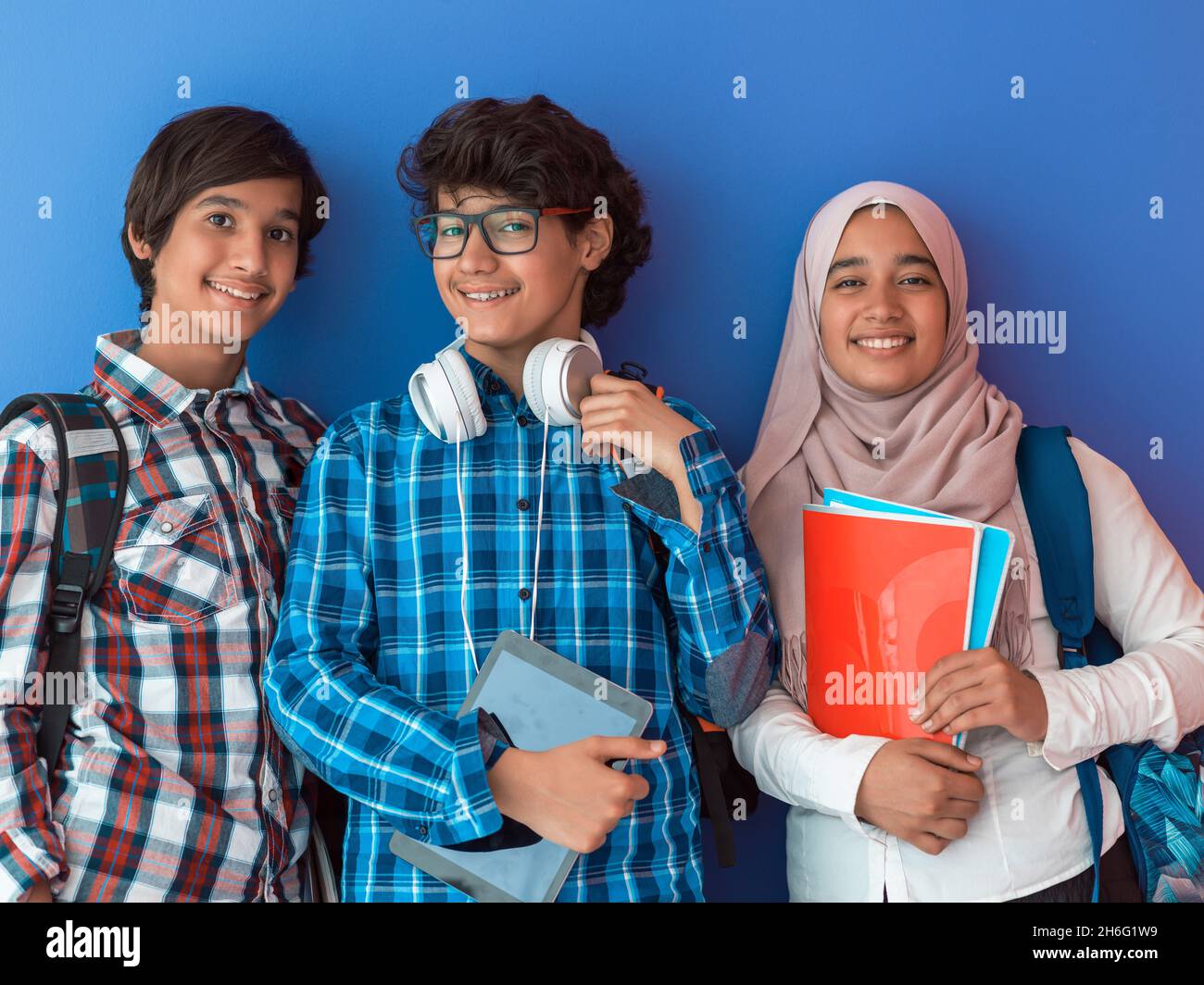 Modern arab teens use smartphone, tablet and latpop to study during ...