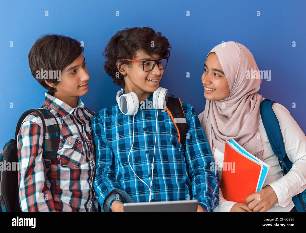 Modern arab teens use smartphone, tablet and latpop to study during ...