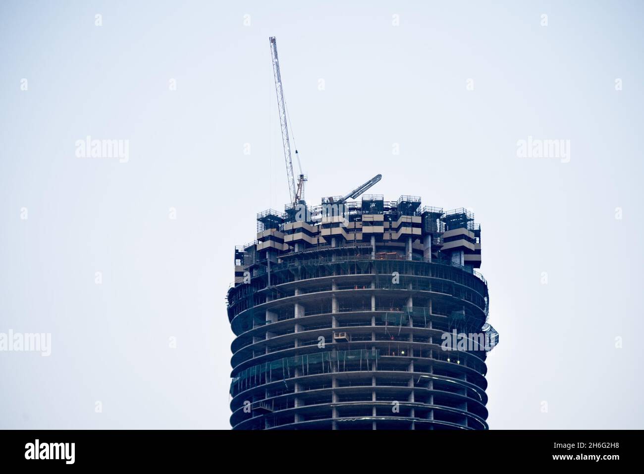 Zoomed in shot showing the top of a huge circular tower with a ...