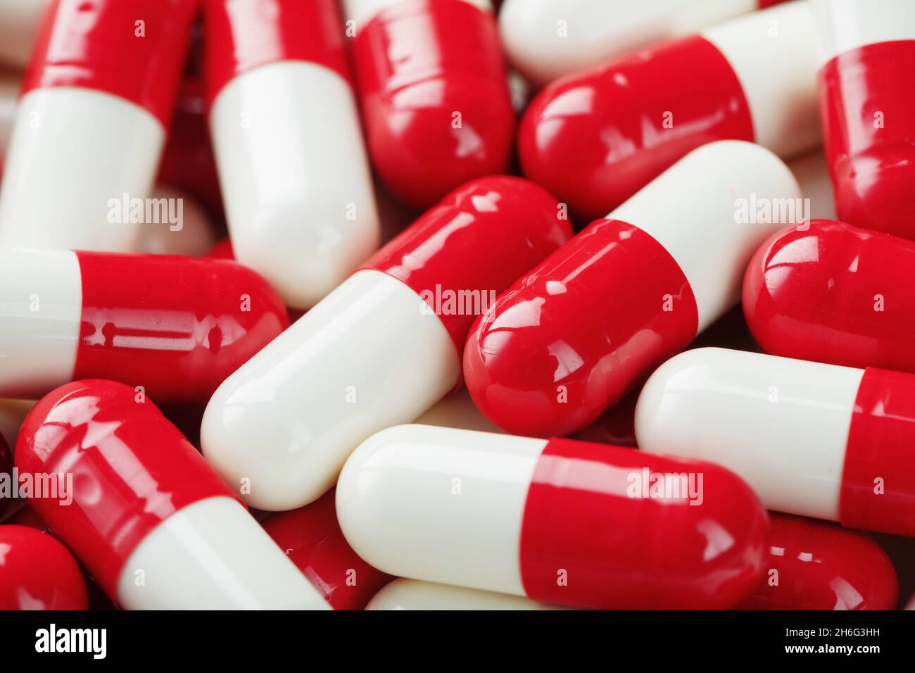Medical medicinal Pills capsules are white and red in color as a ...