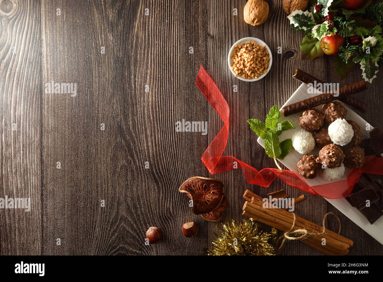 Christmas table background with chocolate and coconut balls on wooden ...
