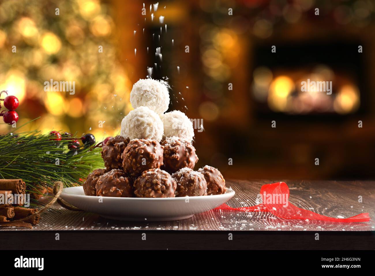 Pile of coconut and chocolate balls on Christmas with grated coconut ...