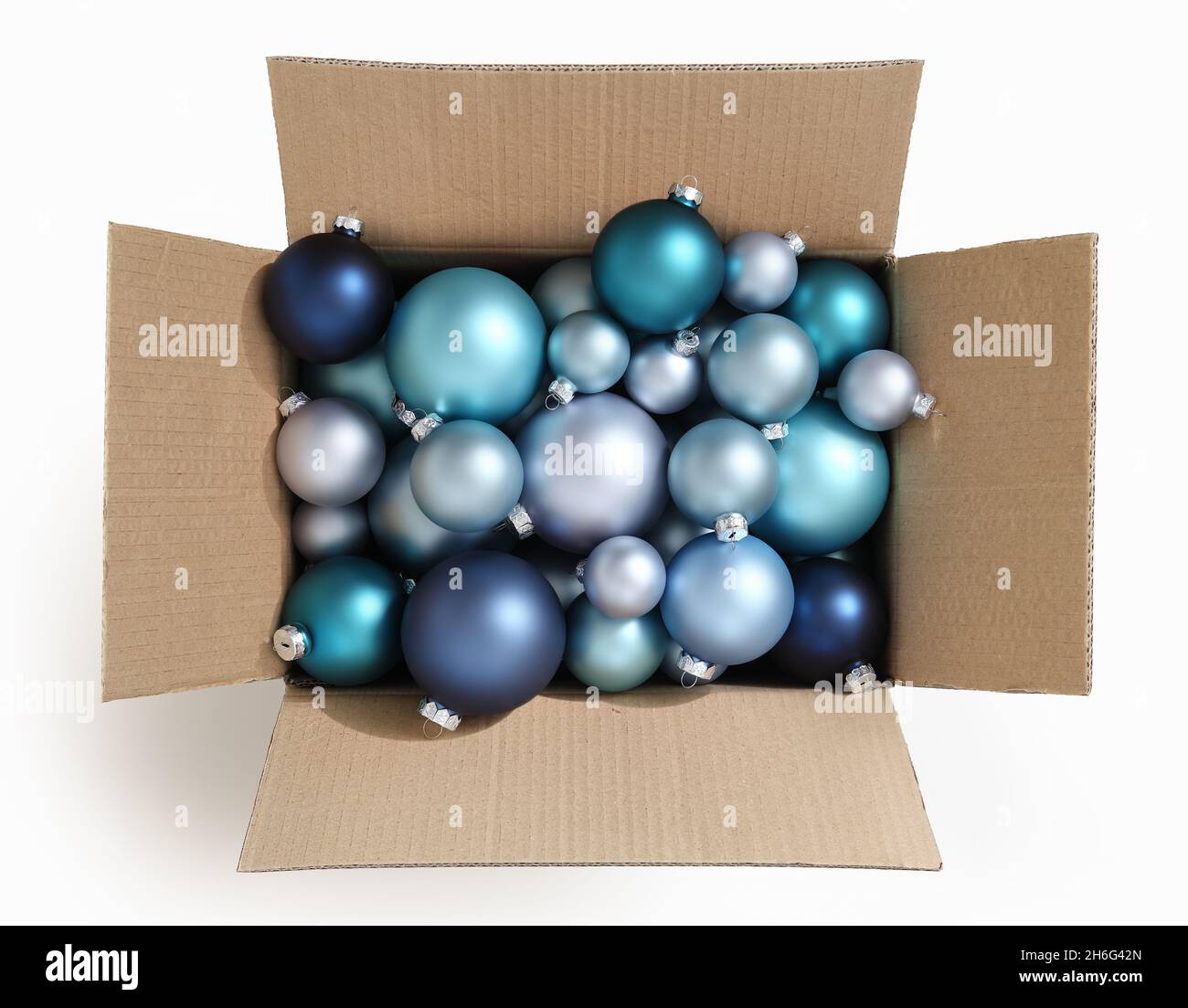 merry christmas, open cardboard box full of blue turquoise xmas balls ...